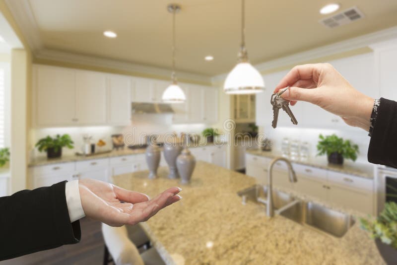 Handing Over New House Keys Inside Beautiful Kitchen Stock Photo ...