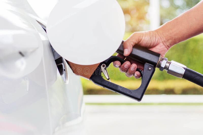 Handle fueling with car. stock image. Image of business - 81515995