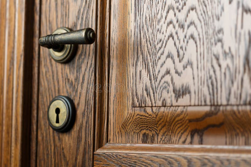 Handle and Keyhole on a Wooden Door in Beautiful Lighting Stock Photo ...