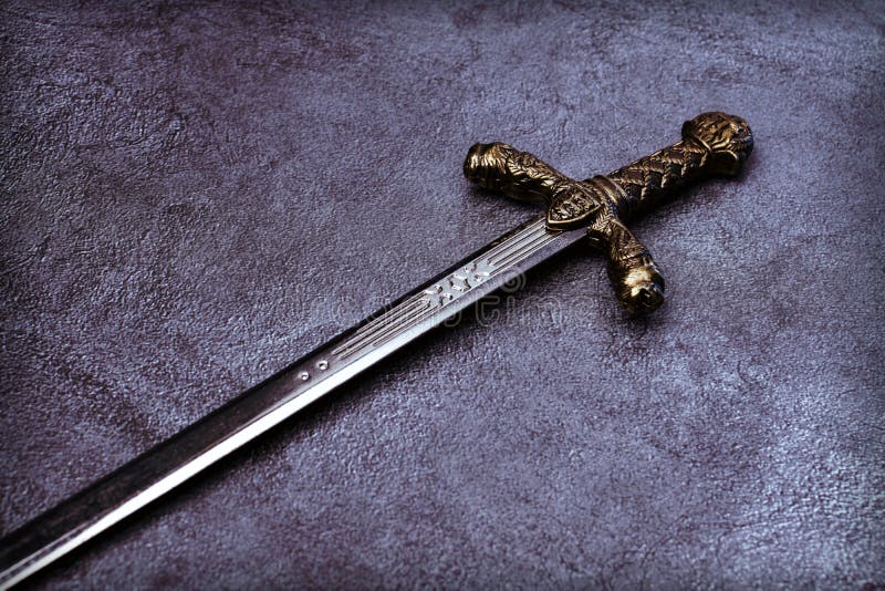 The Handle of a Knight`s Sword on a Gray Background. Stock Image ...