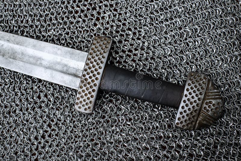 Medieval Sword on Metal Chain Mail Stock Photo - Image of crusade, male ...