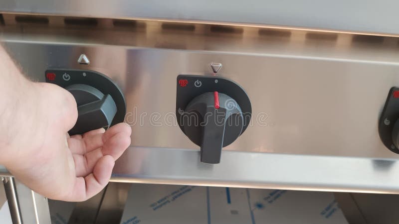 Handle Rotary Handle on a Gas Stove. Turn the Temperature on the Oven ...