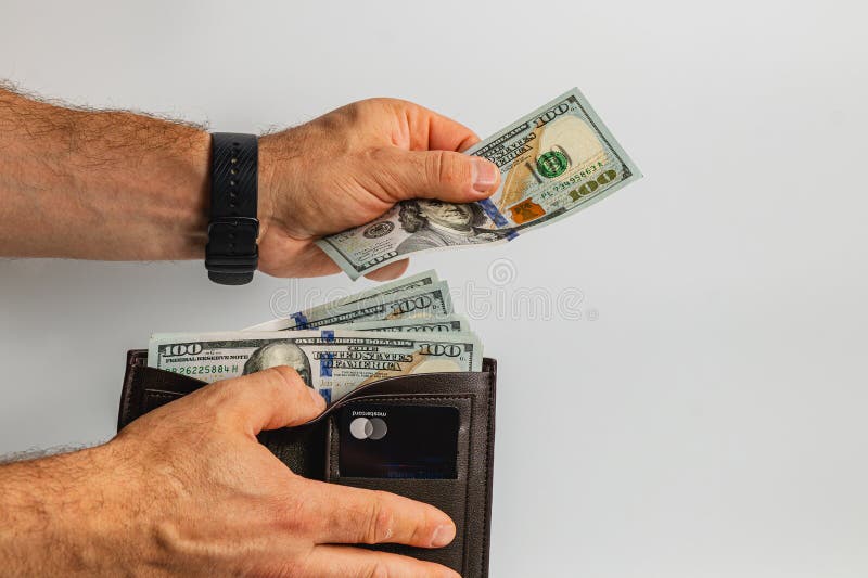 Handling Cash while Checking a Wallet in a Light Setting Stock Photo ...