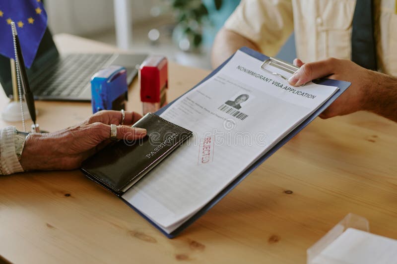 Handling Immigration Visa Application Forms for Approval Stock Photo ...