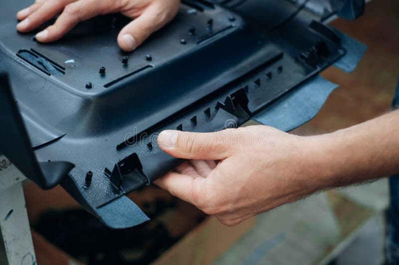 Handling a Molded Plastic Component with Visible Fastening Points and ...