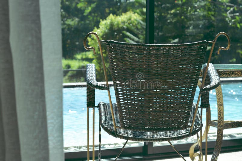 Handmade Black Wicker Chair Made of Rattan. Located at Pool Side Stock ...