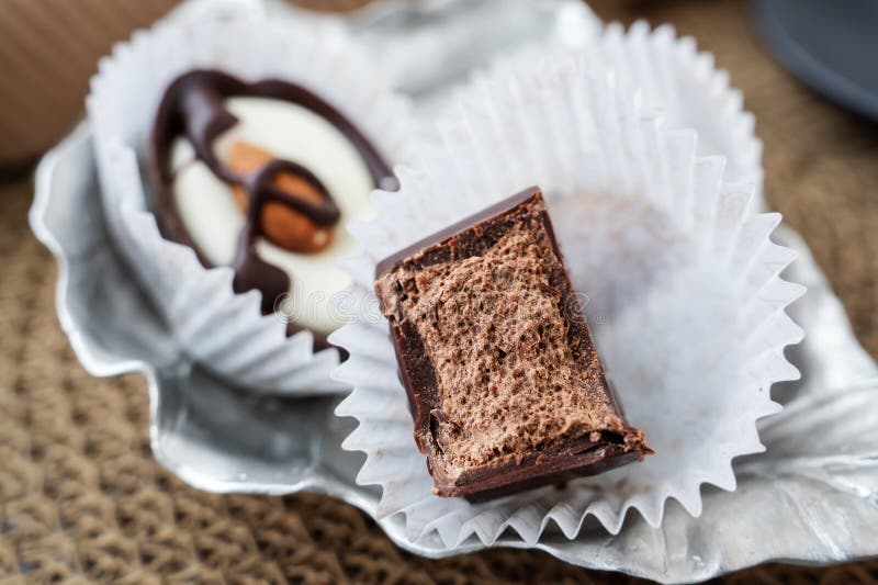 Handmade Candy Bitten Off Close-up on the Table. Handmade Chocolate ...