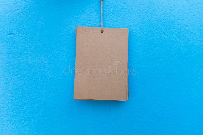 Handmade Card Hanging on the Blue Wall Stock Photo - Image of notebook ...
