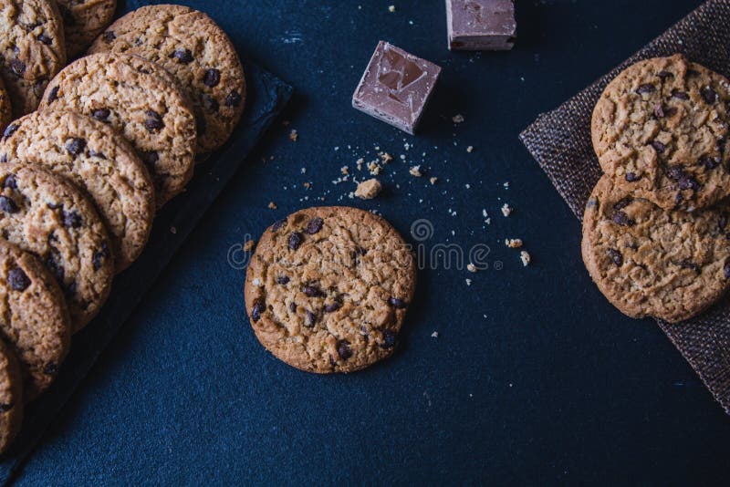 Handmade Chocolate Chip Cookies and Pieces of Cocoa on a Chalkboard ...