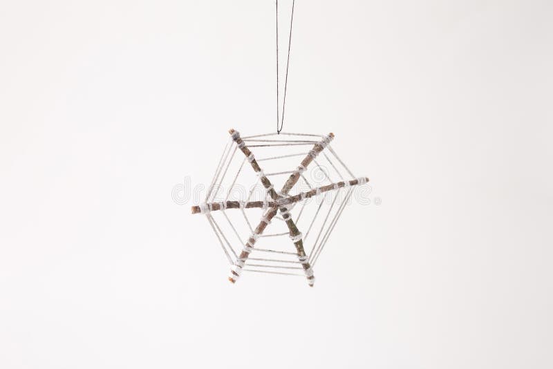 A Handmade Craft Resembling a Spider Web. it is Created Using Six Small ...