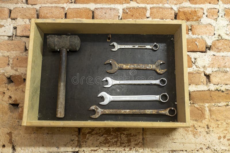 Handmade Decoration of Work Tools on Exposed Brick Wall Stock Image ...