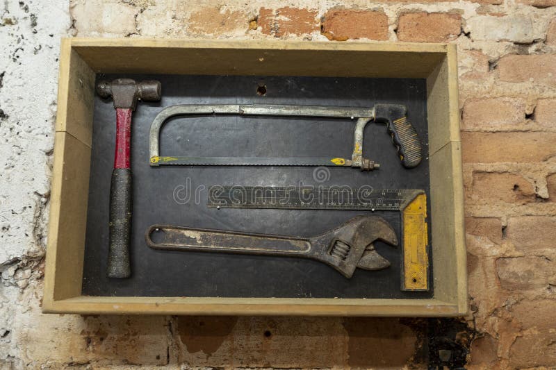 Handmade Decoration of Work Tools on Exposed Brick Wall Stock Image ...