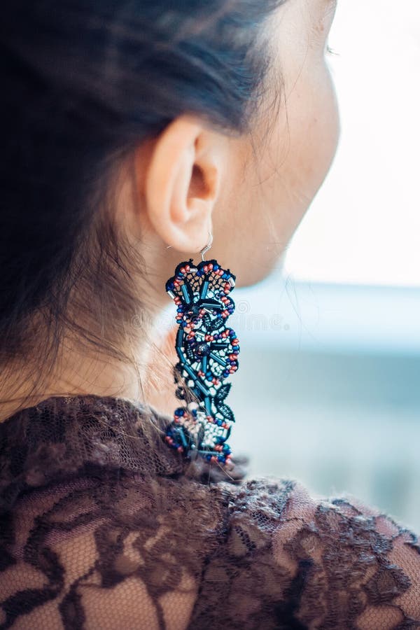 Handmade Earring on the Ear of a Young Woman. Stock Image - Image of ...