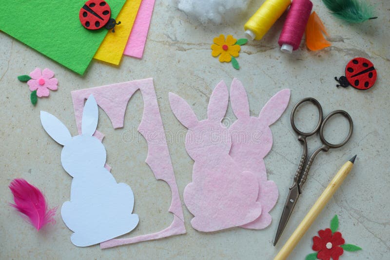 Handmade Easter Bunny Felt Craft Project with Colorful Threads, Scissors, Paper Template, and ...