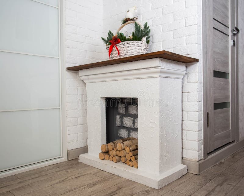 Handmade Fireplace with Logs and Christmas Basket on Top, Close-up ...