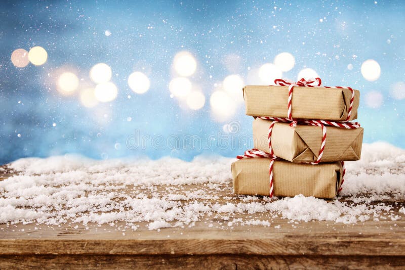 Handmade Gift Boxes Over Snowy Wooden Table Stock Photo - Image of ...
