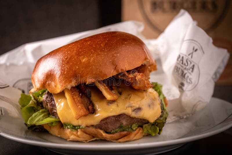 Handmade Hamburger Delivery on a White Plate and Dark Background Stock ...