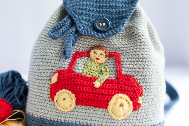 Handmade Knitted Backpack And Colorful Tangles Of Yarn Stock Photo ...