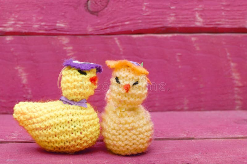 Handmade Knitted Woollen Easter Chicks on Pink Wooden Background Stock ...