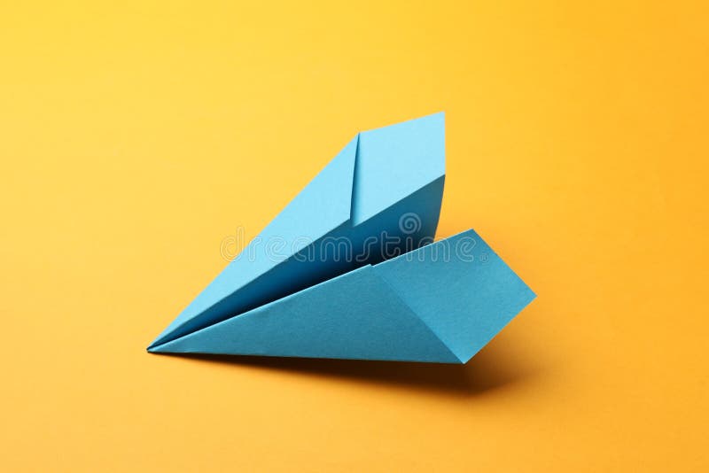 Handmade Light Blue Paper Plane on Yellow Background Stock Photo ...