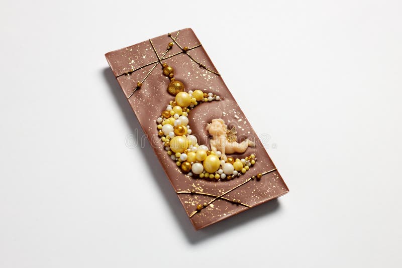 Handmade Milk Chocolate Bar with Crescent Moon and Angel Figure Stock ...