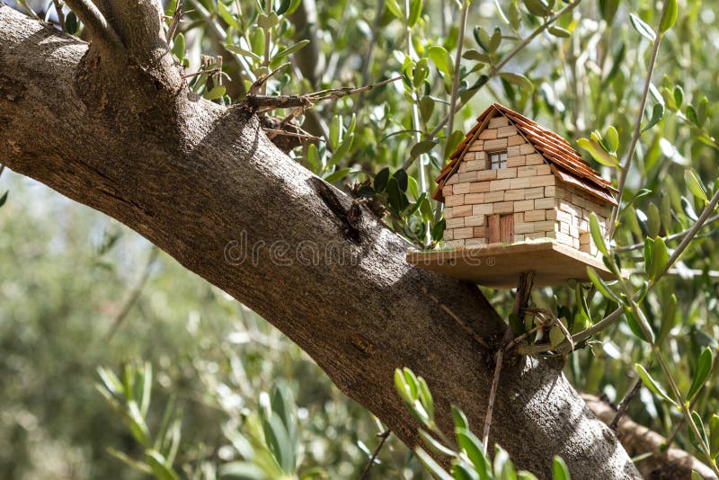 Handmade Miniature House in the Branches of a Tree Stock Photo - Image ...