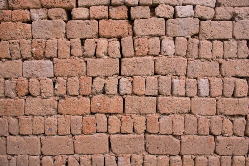 Handmade mud brick wall. stock image. Image of iron - 251911417