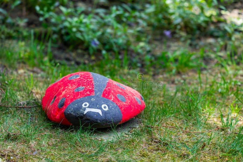 Handmade Painted Acrylic Stone Ladybug in Garden Stock Photo - Image of ...
