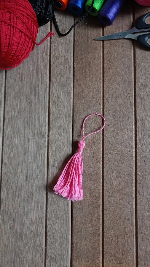Handmade Pink Tassel on Rustic Wood Stock Image - Image of fabric ...