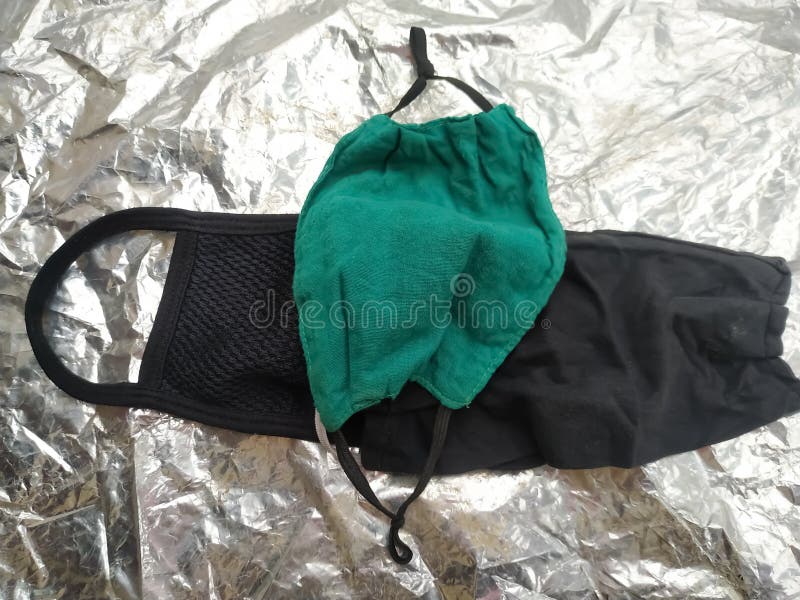 Handmade Protective Mask and Piece of Cloth on White Background. Stock ...