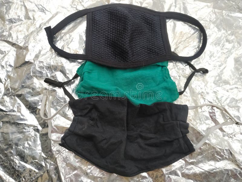 Handmade Protective Mask and Piece of Cloth on White Background. Stock ...