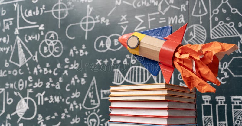 Handmade Rocket on Stacked Books with Blackboard Full of Science and Math Formulas Education ...