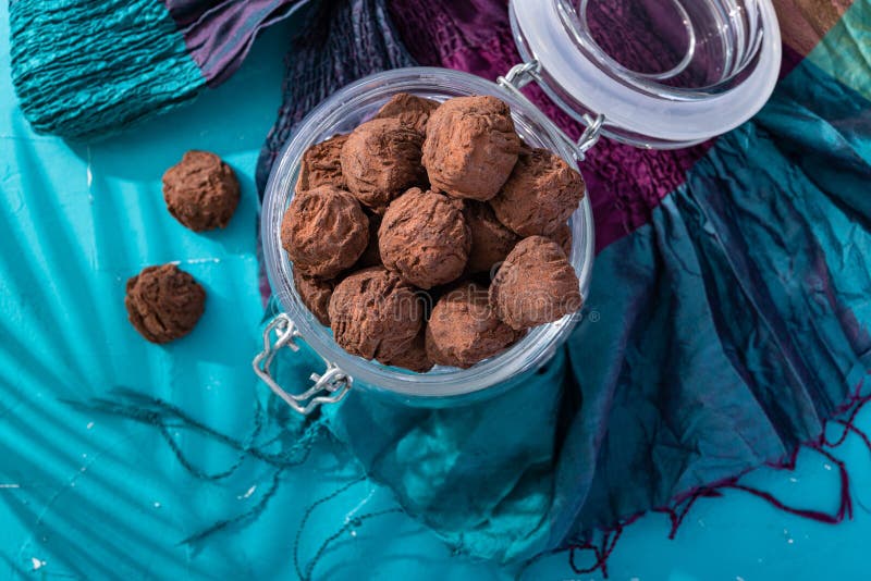 Handmade Rustic Chocolate Truffles in Jar on Turquoise Scarf Stock ...