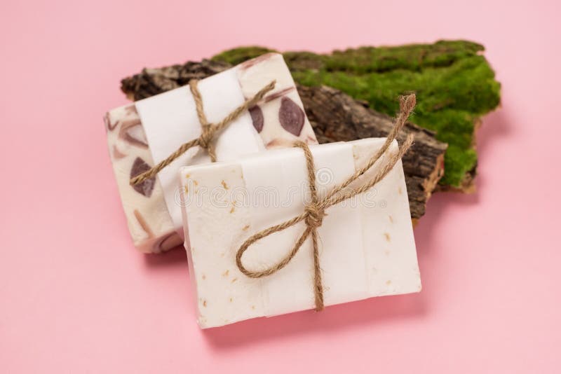 Handmade Soaps on Wooden Bark with Moss Pink Background Minimal ...