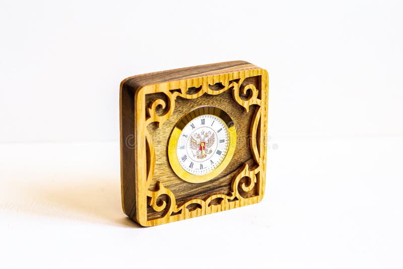 Handmade Wooden Clock with Patterns and the Emblem of Russia on a White ...