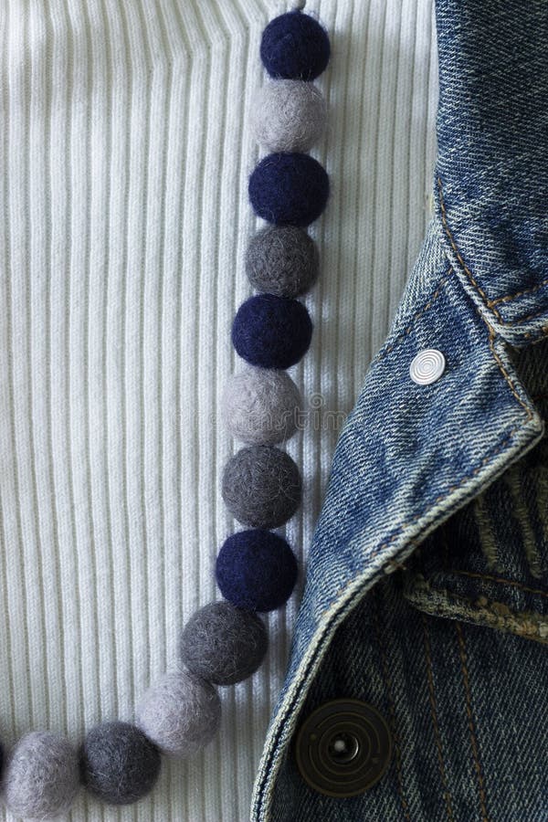 Handmade Wool Necklace on the Background of Clothes. Stock Image ...