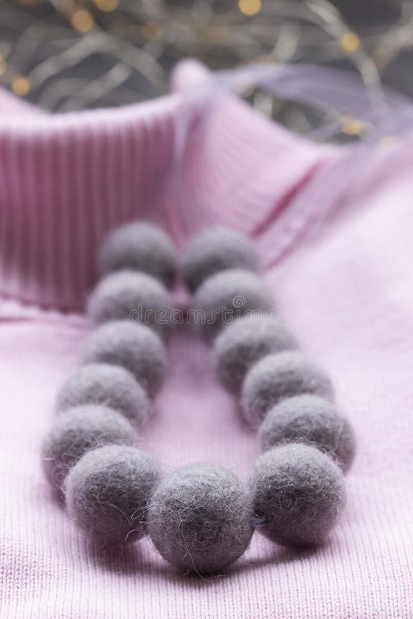 Handmade Wool Necklace on the Background of Clothes. Stock Image ...