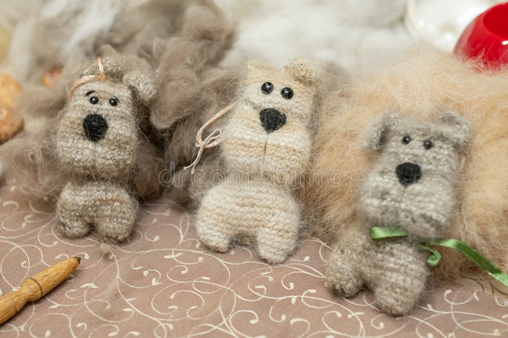 Handmade Woolen Dog Figurines on Patterned Fabric Stock Image - Image ...