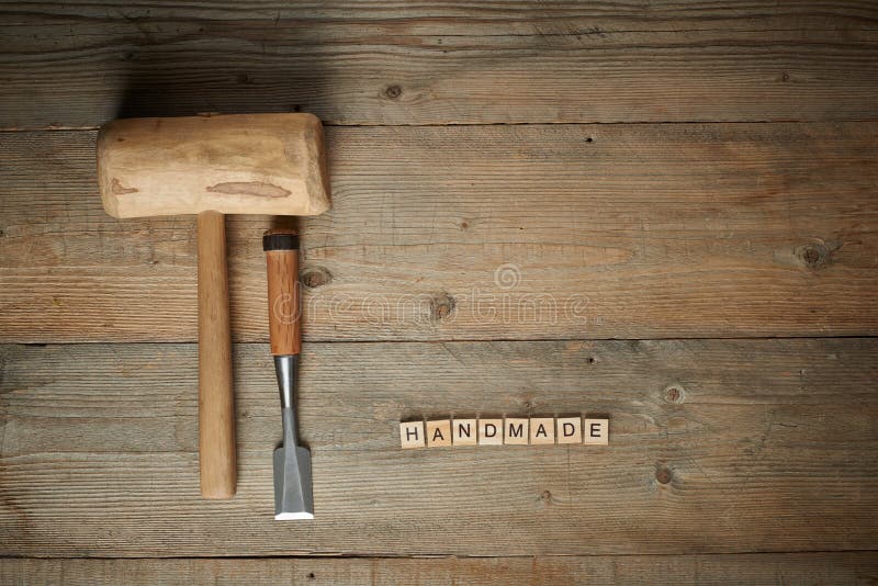 Handmade Word with Mallet and Chisel on a Wooden Workbench, Top Stock ...
