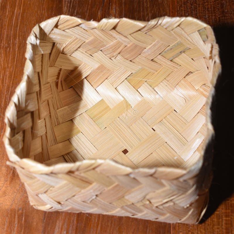 Handmade Woven Bamboo Container on the Wooden Table Stock Image - Image ...