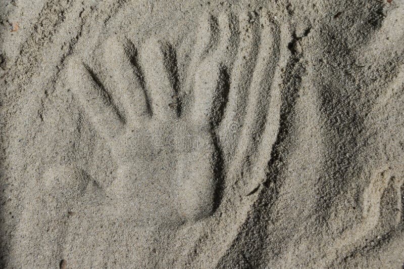 Handprint in the Sand stock image. Image of human, fingers - 68599599