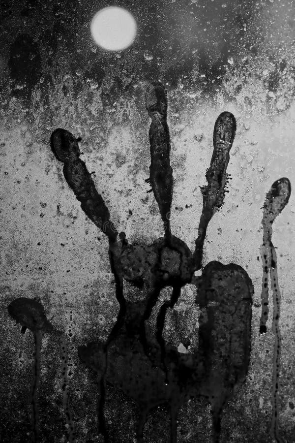 Handprint on a wet glass stock photo. Image of design - 186125070