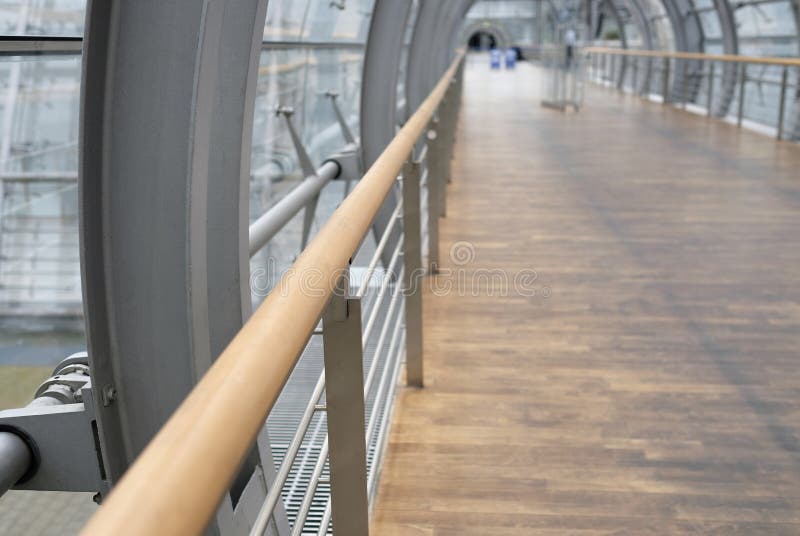 Handrail in a Building with a Glass Ceiling and Windows Under the ...