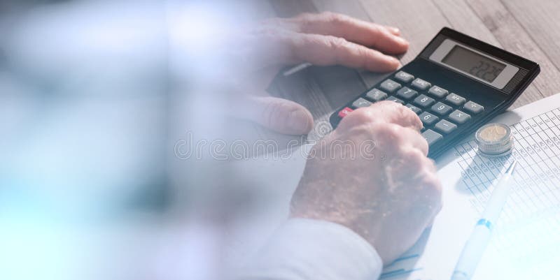Hands of an Accountant Working on Financial Documents, Light Effect ...