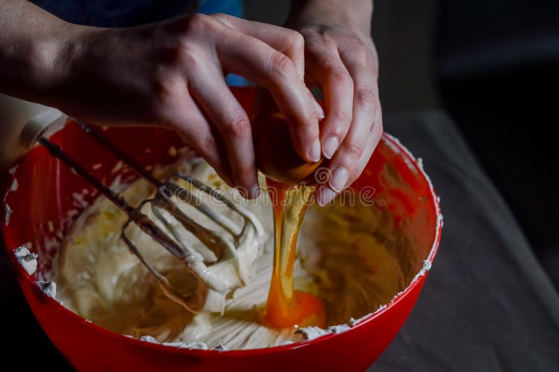 Hands Adding Egg To Fresh White Cheese Being Whipped Together To Make ...