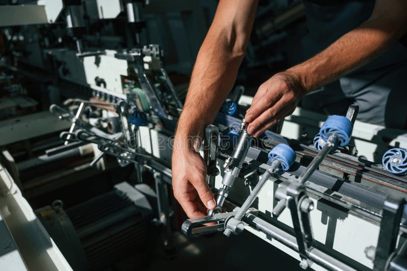 Hands are Adjusting the Machine. Handsome Man is Working at the Factory ...