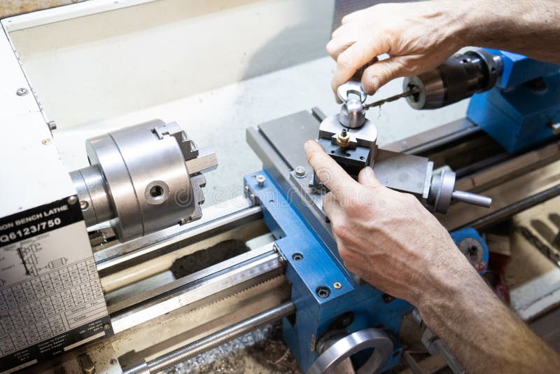 Hands of Man Adjusting a Part on the Lathe in the Workshop Stock Photo ...