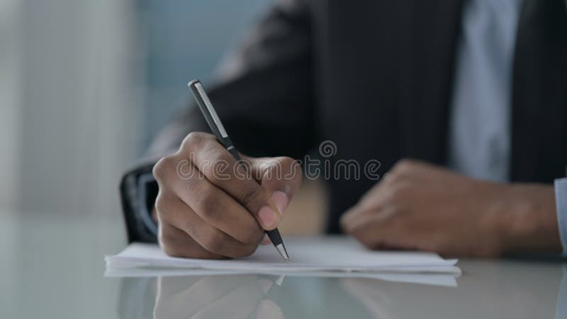 Hands of African Businessman Writing on Paper Stock Image - Image of ...