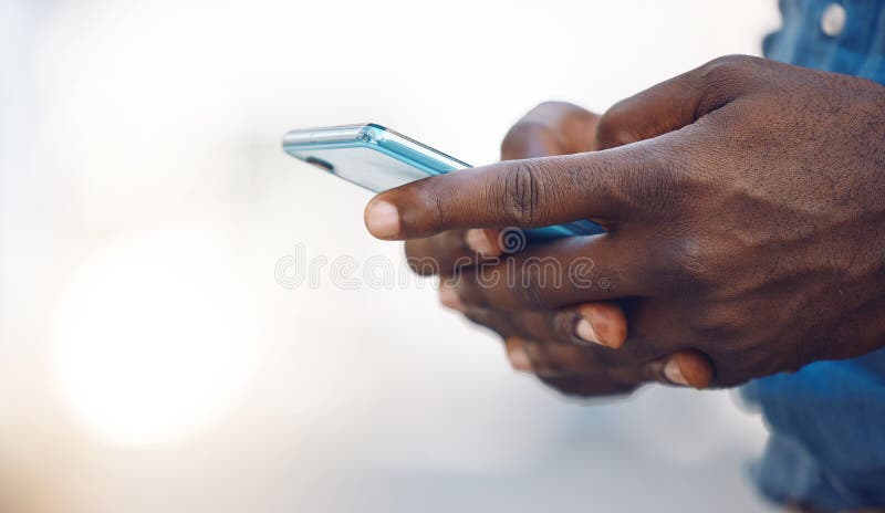 Hands of an African Man on a Phone Networking, Doing Research on the ...