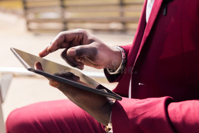 Hands of an African Man Using a Tablet Outdoors Stock Photo - Image of ...